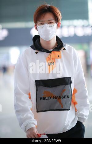 Chinese singer and actor Dong Li arrives at a Shanghai airport before ...