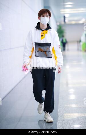 Chinese singer and actor Dong Li arrives at a Shanghai airport before ...