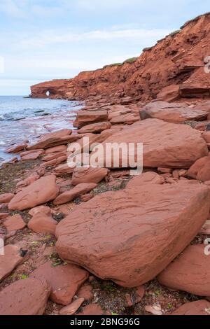 Natural arch among sandstone cliffs. Coastal erosion on Prince Edward ...