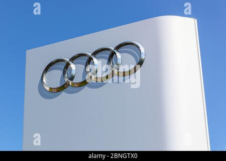 Corporate trademarked sign for Audi cars and vehicles on a raised sign ...