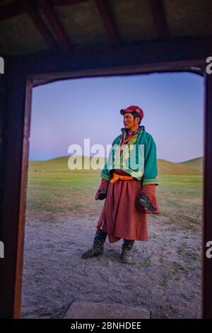 mongolian man in traditional outfit near old Temple in Ulaanbaatar ...