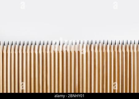 Smooth beautiful neatly sharpened pencils made of wood lie on a white ...