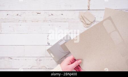 Flat lay. Step by step. Cutting out snowflakes with cookie cutters out ...