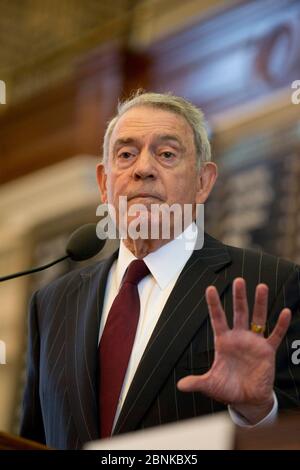 A reporter speaks into a microphone for a broadcast Stock Photo - Alamy