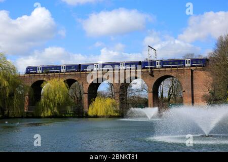 Greater Anglia train passing over the viaduct in Central Park ...