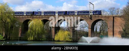 Greater Anglia train passing over the viaduct in Central Park ...
