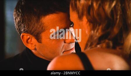 USA. George Clooney and Elle Macpherson in a scene from the ©Warner ...