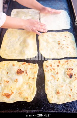 Preparation of Moroccan msemen pancakes Stock Photo - Alamy