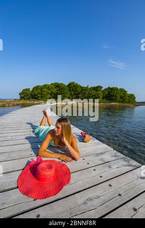 Adolescent teen laying lying down position posture Stock Photo - Alamy
