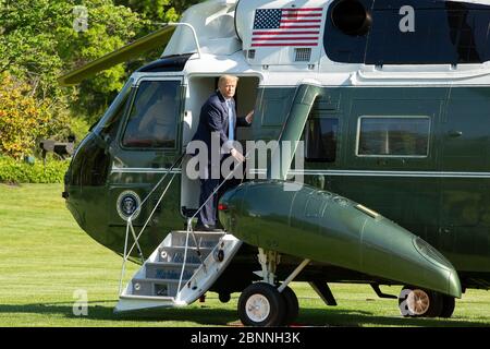 President Donald Trump pauses as he boards Air Force One at Miami ...