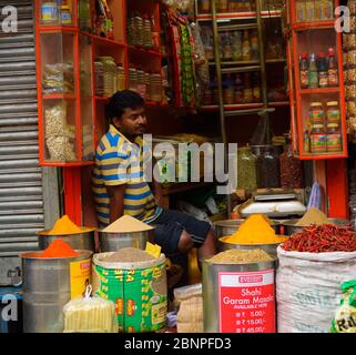 shopkeeper selling grocery items in his shop Stock Photo - Alamy