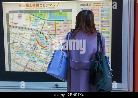Japan, Honshu, Tokyo, Ginza, Women in front of Daniel Craig Poster ...