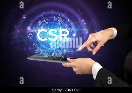 Close-up of a touchscreen with CSR abbreviation, modern technology ...