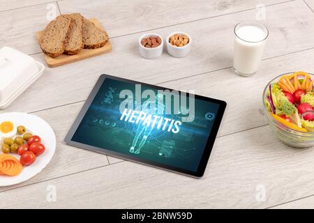 HEPATITIS concept in tablet with fruits, top view Stock Photo - Alamy