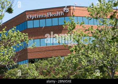 A logo sign outside of the headquarters of Optima Health in Virginia ...
