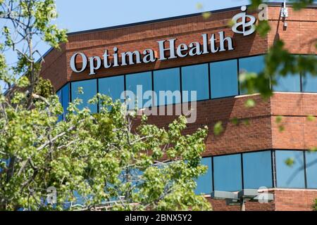 A logo sign outside of the headquarters of Optima Health in Virginia ...