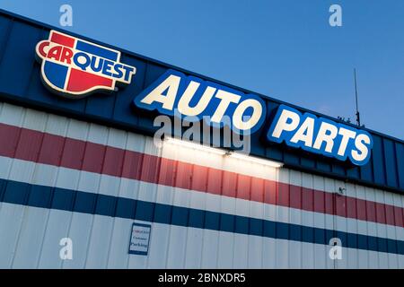A logo sign outside of a Carquest Auto Parts retail store location in ...