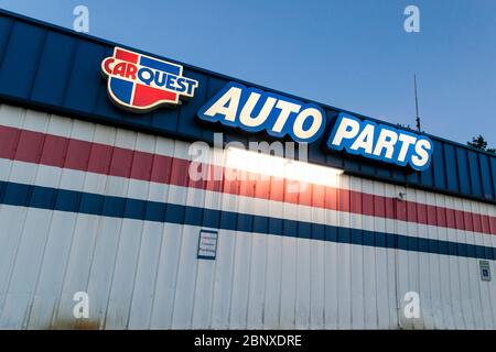 A logo sign outside of a Carquest Auto Parts retail store location in ...