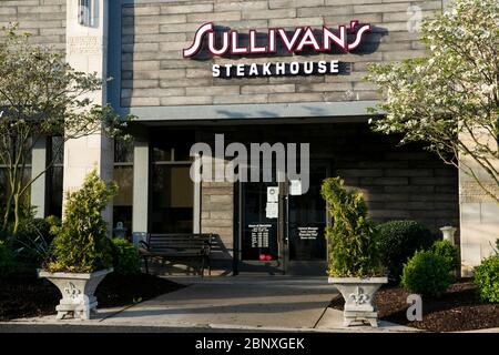 A logo sign outside of a Sullivans Steakhouse restaurant location in ...
