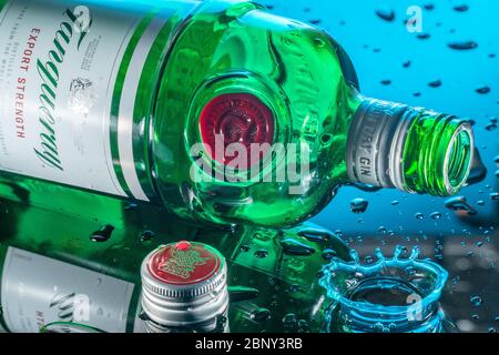 Bedford,UK,May 16,2020. Coca Cola can with splashes of water on a black ...
