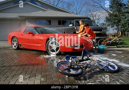 Two boy's washing a classic Chevrolet Corvette Stock Photo - Alamy