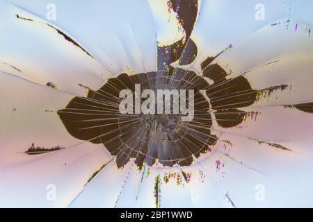 close-up view of physically damaged lcd screen surface with multiple ...