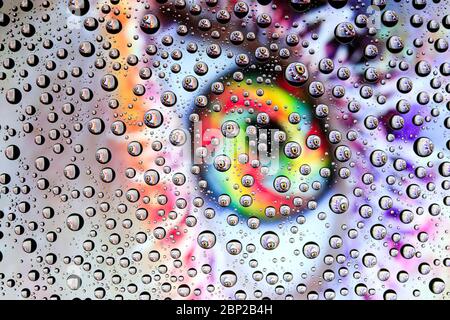 Female eye through drops of water on glass Stock Photo - Alamy