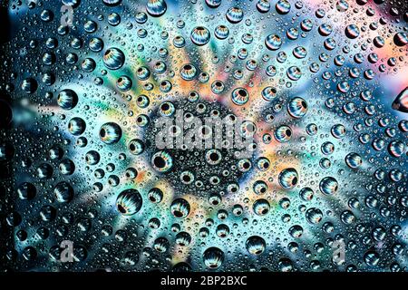 human eye close-up through drops of water on glass Stock Photo - Alamy