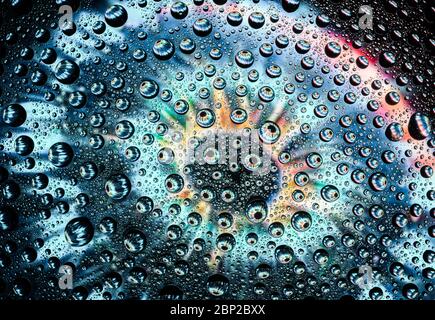 human eye close-up through drops of water on glass Stock Photo - Alamy