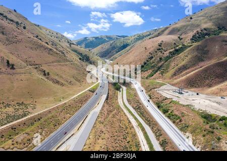 Aerial view above I-5 highway at the Grapevine, in Kern County ...