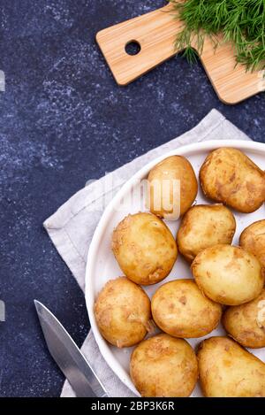 Young uncooked fresh potato and dill Stock Photo - Alamy