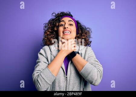 Beautiful curly arab sportswoman doing sport wearing sportswear over ...