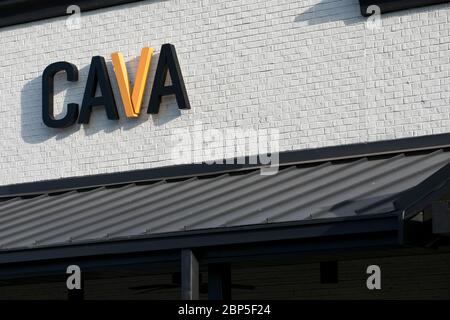 A logo sign outside of a Cava restaurant location in Chantilly ...