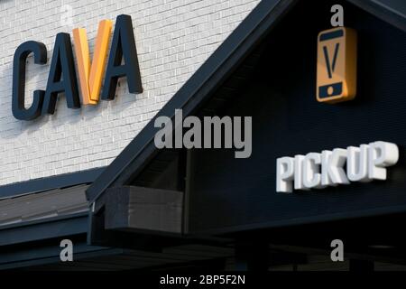 A logo sign outside of a Cava restaurant location in Chantilly ...