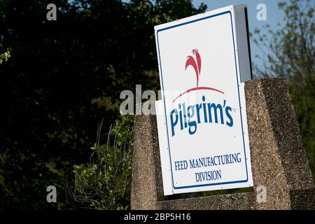 A logo sign outside of a Pilgrim's Pride poultry processing plant in ...