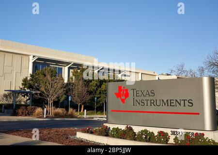 An entrance to Texas Instruments Inc., in Dallas is shown April, 18 ...