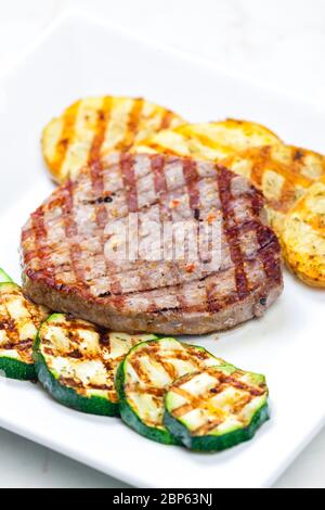 grilled tuna with potatoes and zucchini Stock Photo - Alamy