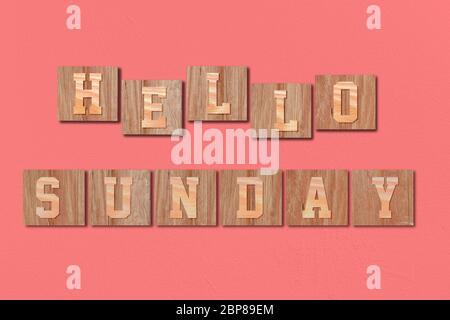 Hello Sunday alphabet letters on blue background Stock Photo - Alamy