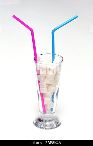 Plastic glass full of sugar with straw on grey background Stock Photo ...