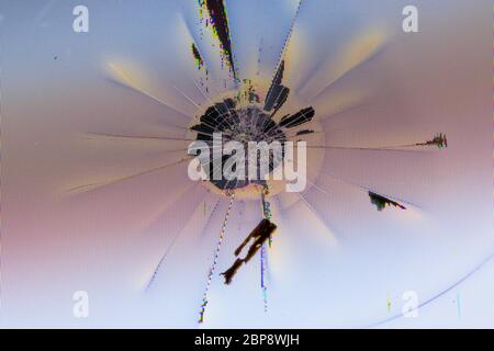 close-up view of physically damaged lcd screen surface with multiple ...