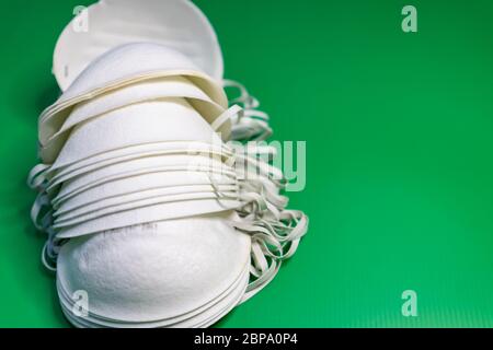 N95 Face Masks on a green background. Multiple stocks of N95 face masks ...