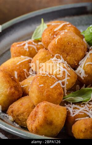 Golden fried mini croquette with parmesan cheese, delicious with tomato ...