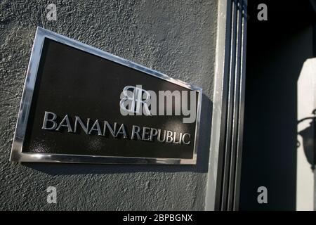 A logo sign outside of a Banana Republic retail store location in ...