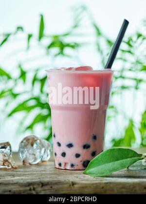Plastic cup of tasty bubble tea with lemon on white background Stock ...