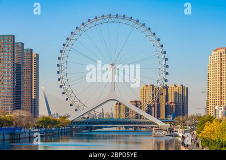 The Tianjin Eye Ferris Wheel on Yongle Bridge over the Hai River, China ...