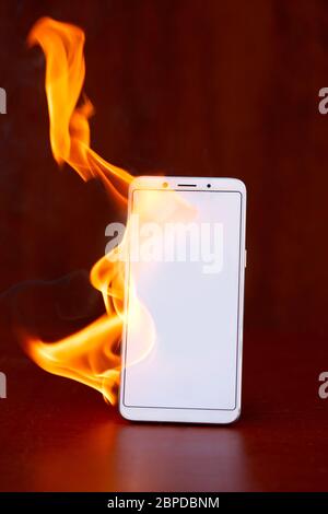Flaming smartphone. The phone is on fire. Mobile smartphone blank flame ...