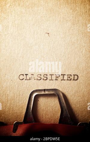 Classified word written on a paper Stock Photo - Alamy