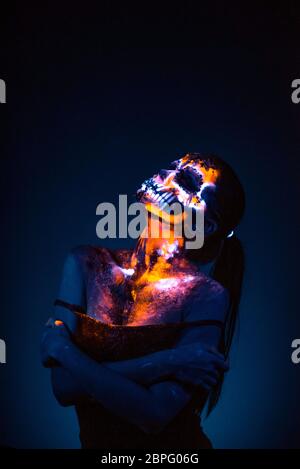Girl's Face painted in fluorescent UV colors and looks like Neon ...