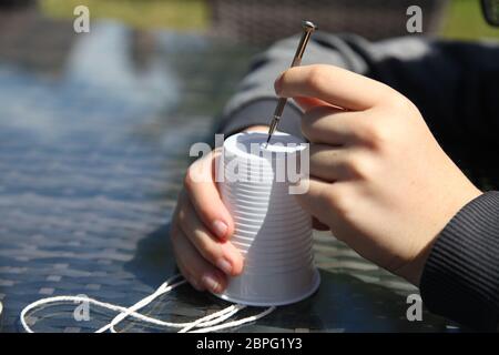 Making a telephone from plastic cups and string, science experiment ...