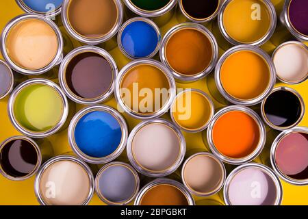 Paint cans color palette, yellow background Stock Photo - Alamy